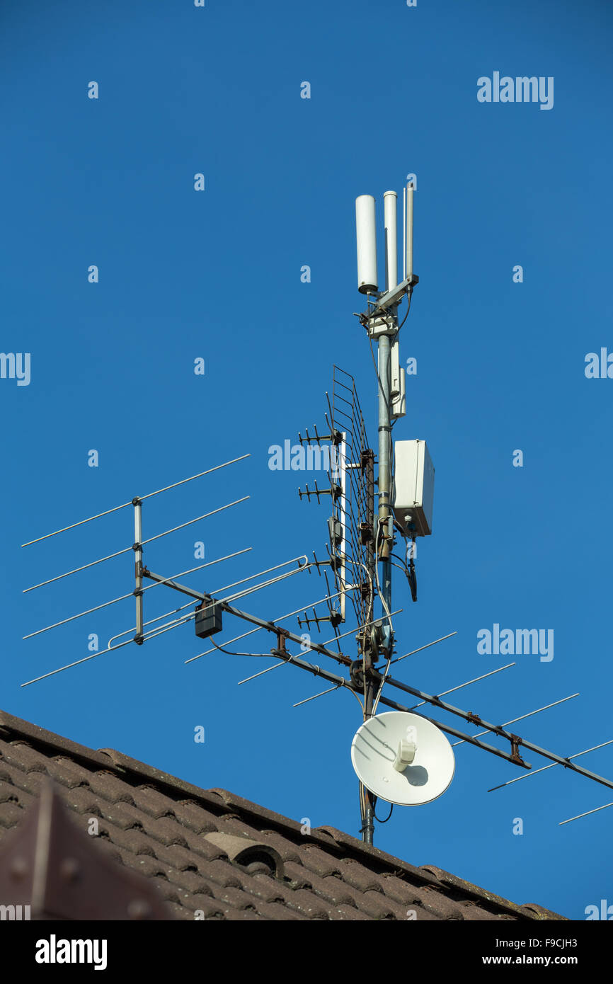television antenna and wi-fi transmitter on the roof Stock Photo - Alamy