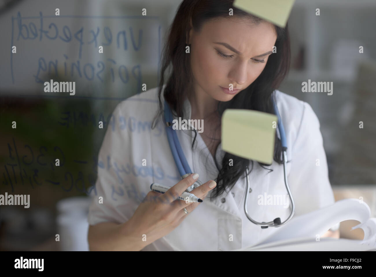 Doctor working at office with patient symptoms and test results Stock ...