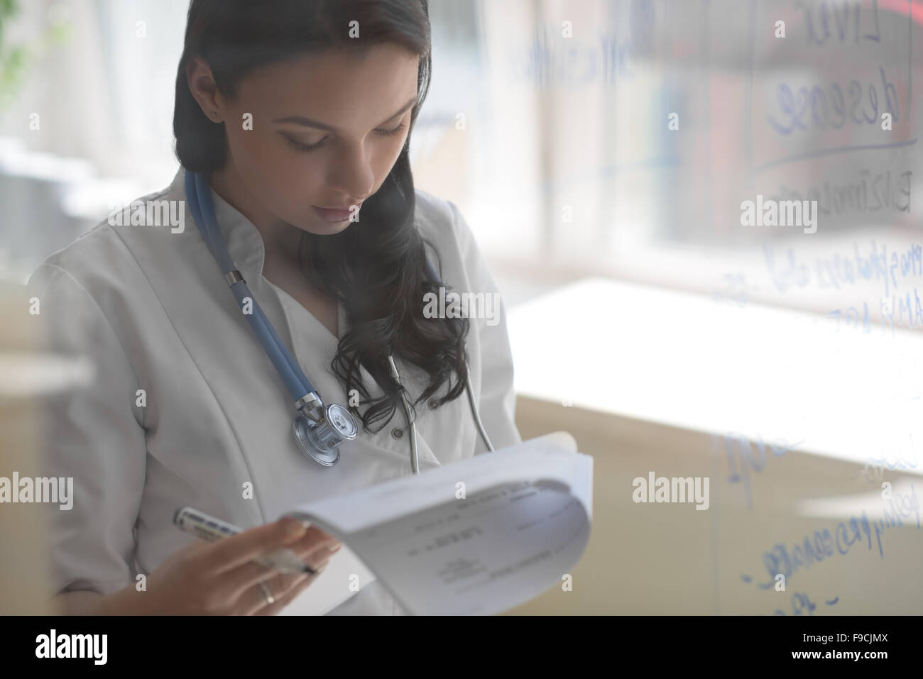 Doctor working at office with patient symptoms and test results Stock ...