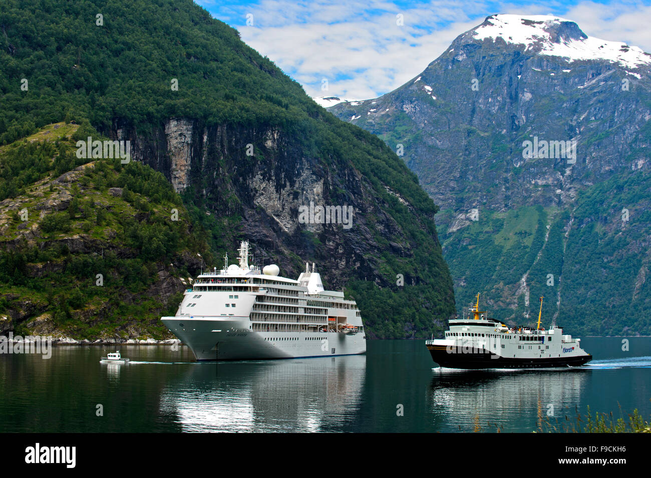 Cruise ship Silver Whisper and a local ferry in the Geirangerfjord ...
