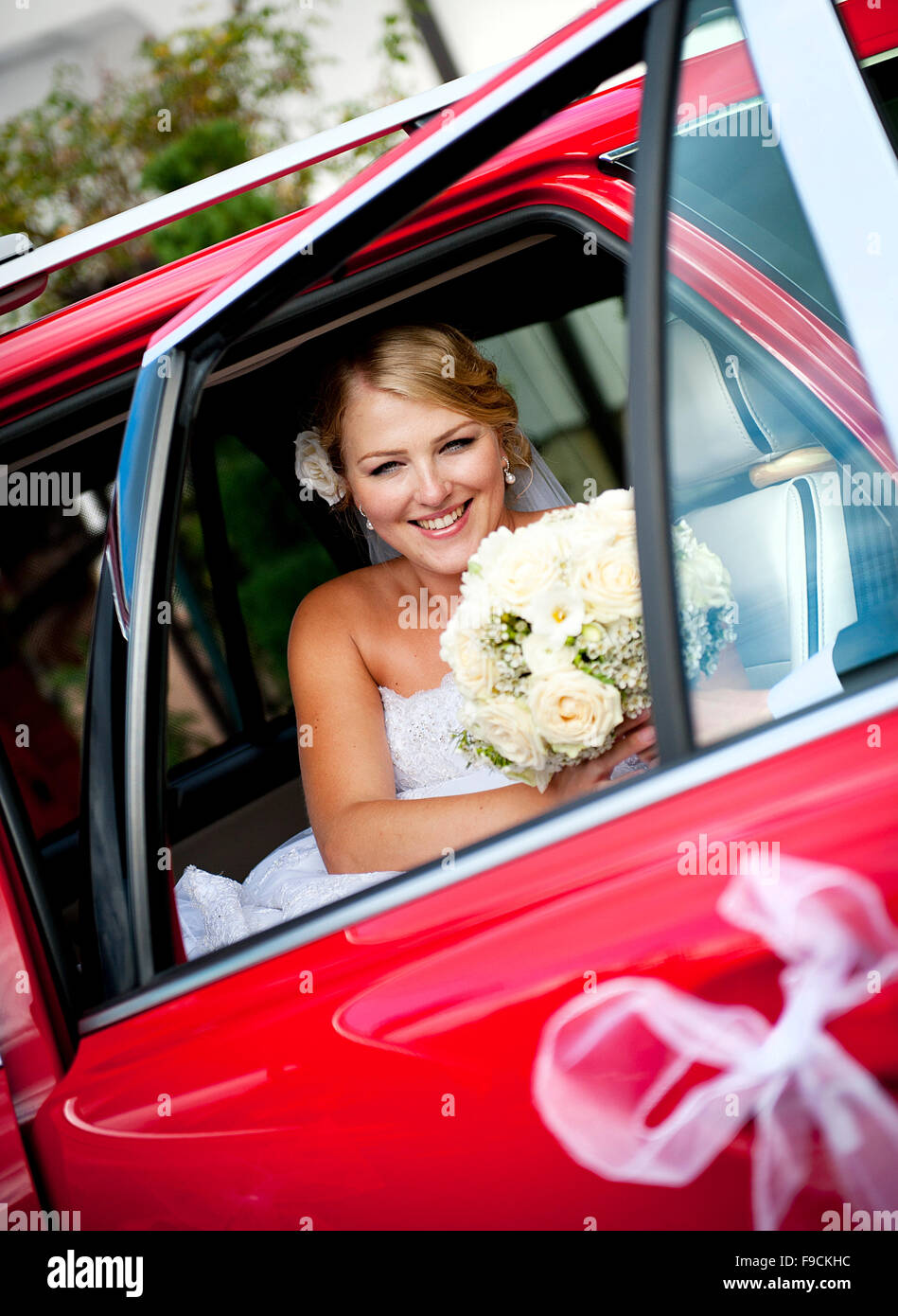 Bride and groom in the car at the wedding day Stock Photo - Alamy