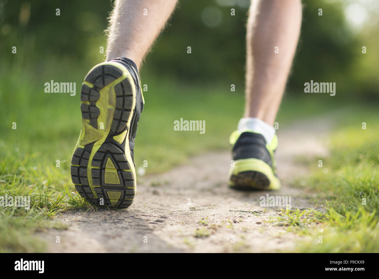 Sporty man running in nature hi-res stock photography and images - Alamy