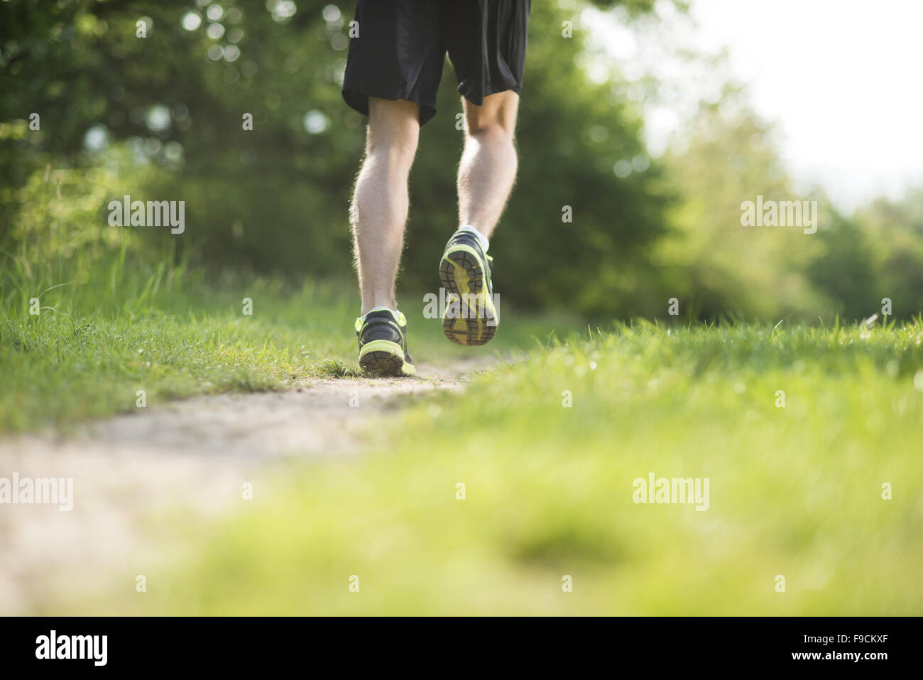 Man running in sunny hi-res stock photography and images - Alamy