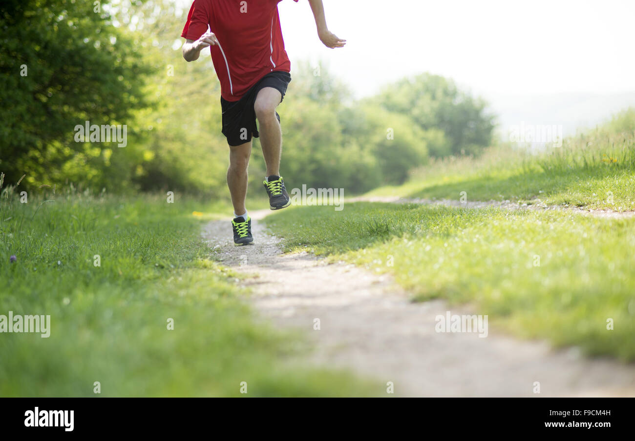 Sporty man running in nature hi-res stock photography and images - Alamy