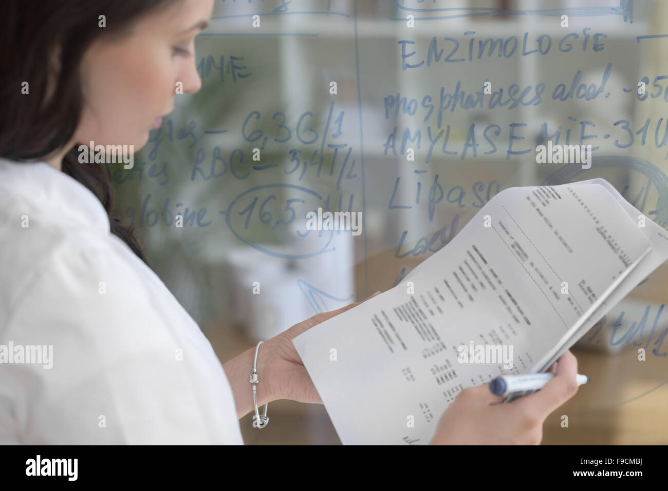 Doctor working at office with patient symptoms and test results Stock ...