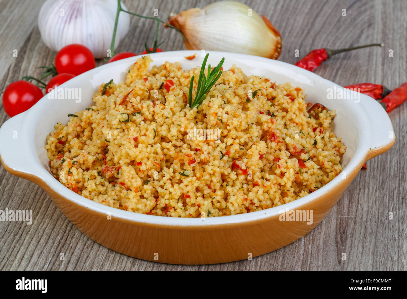 Arabic traditional cuisine - Couscous with tomato and green onion Stock ...