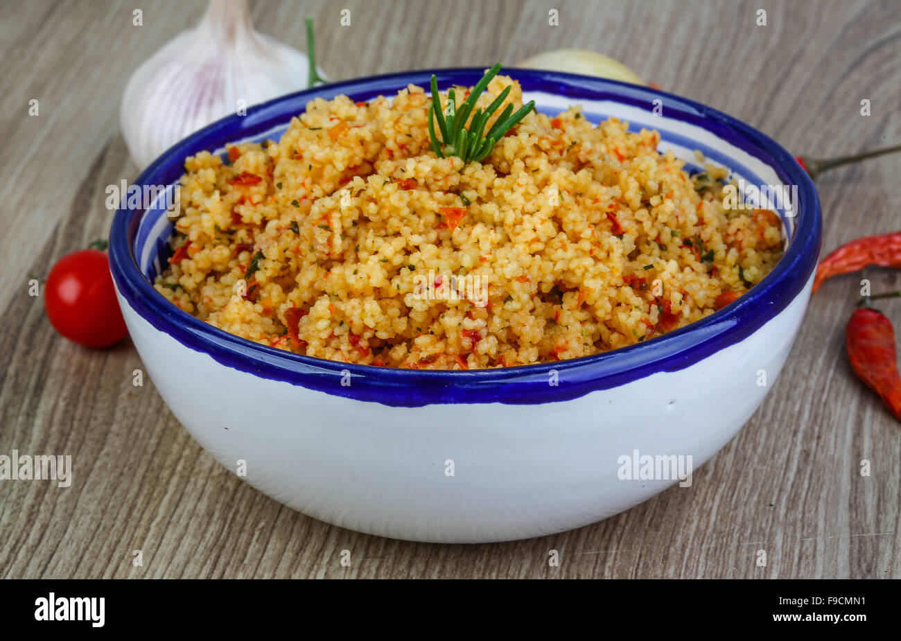 Arabic traditional cuisine - Couscous with tomato and green onion Stock ...