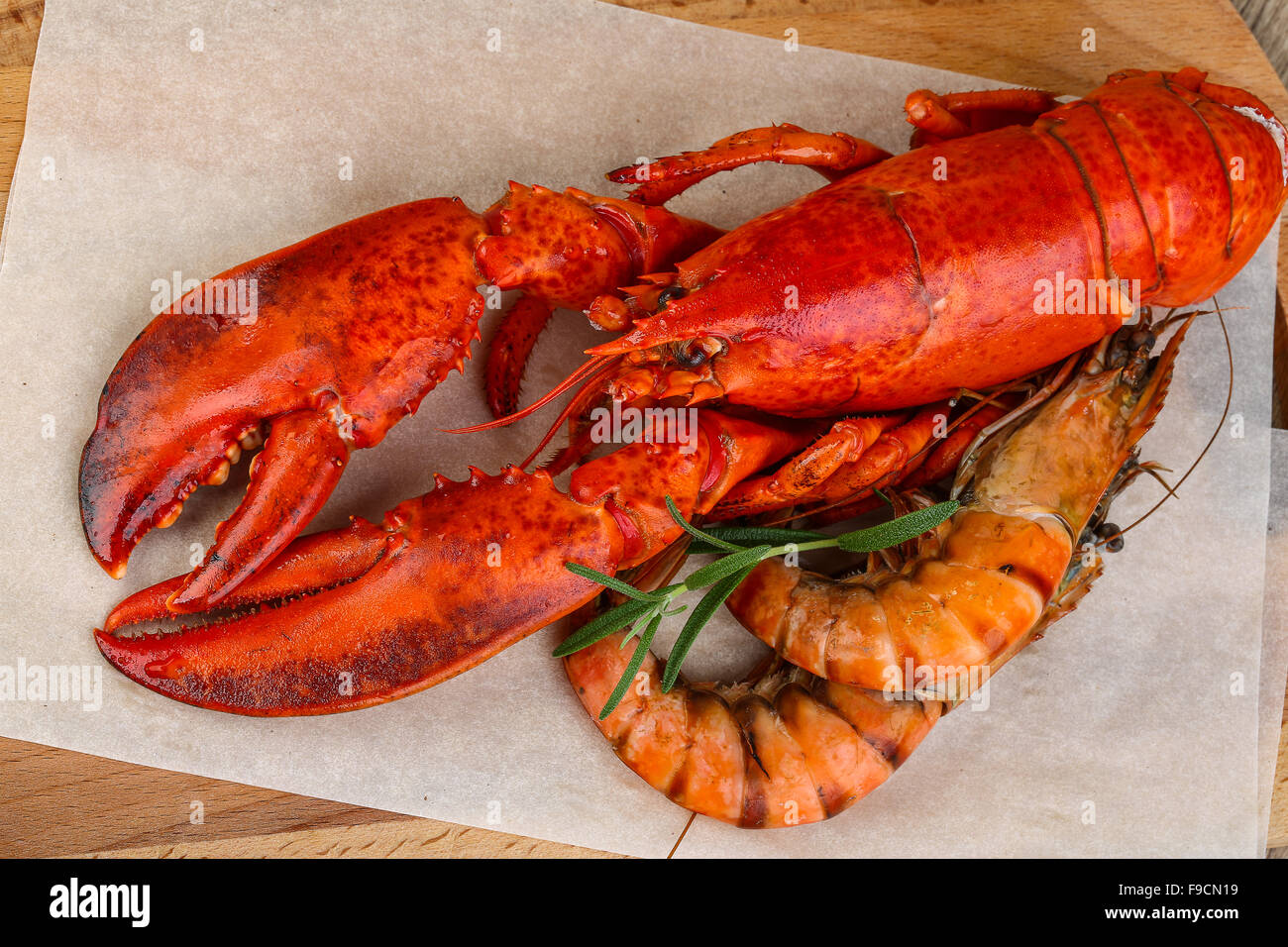 Big cooked lobster and tiger shrimps ready for eating Stock Photo - Alamy