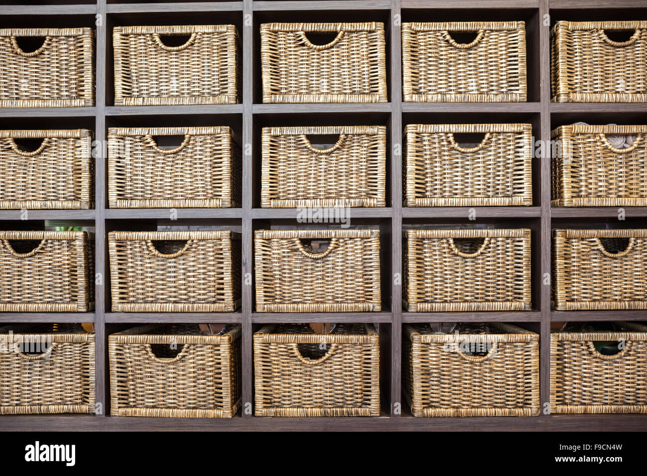 handles wicker baskets on an wooden rack Stock Photo - Alamy