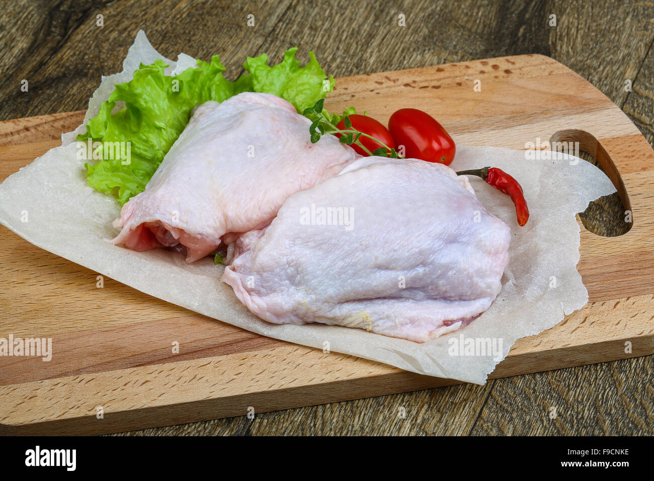 Raw chicken legs meat with herbs and spices ready for cooking Stock ...