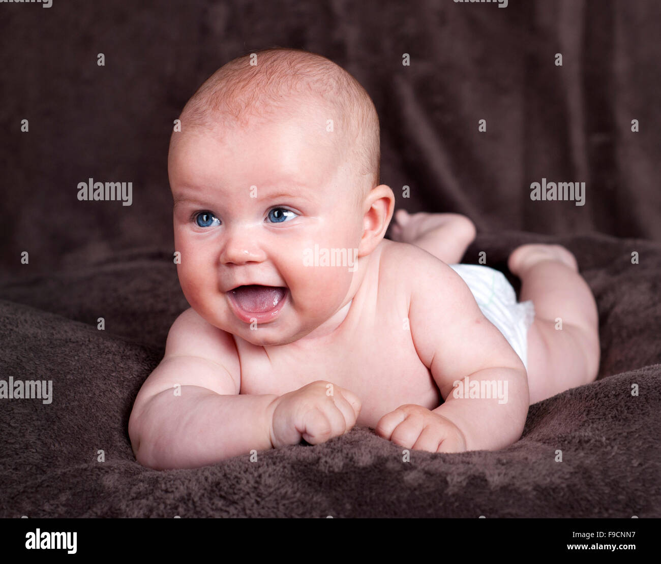 Three months old baby has lot of fun Stock Photo - Alamy
