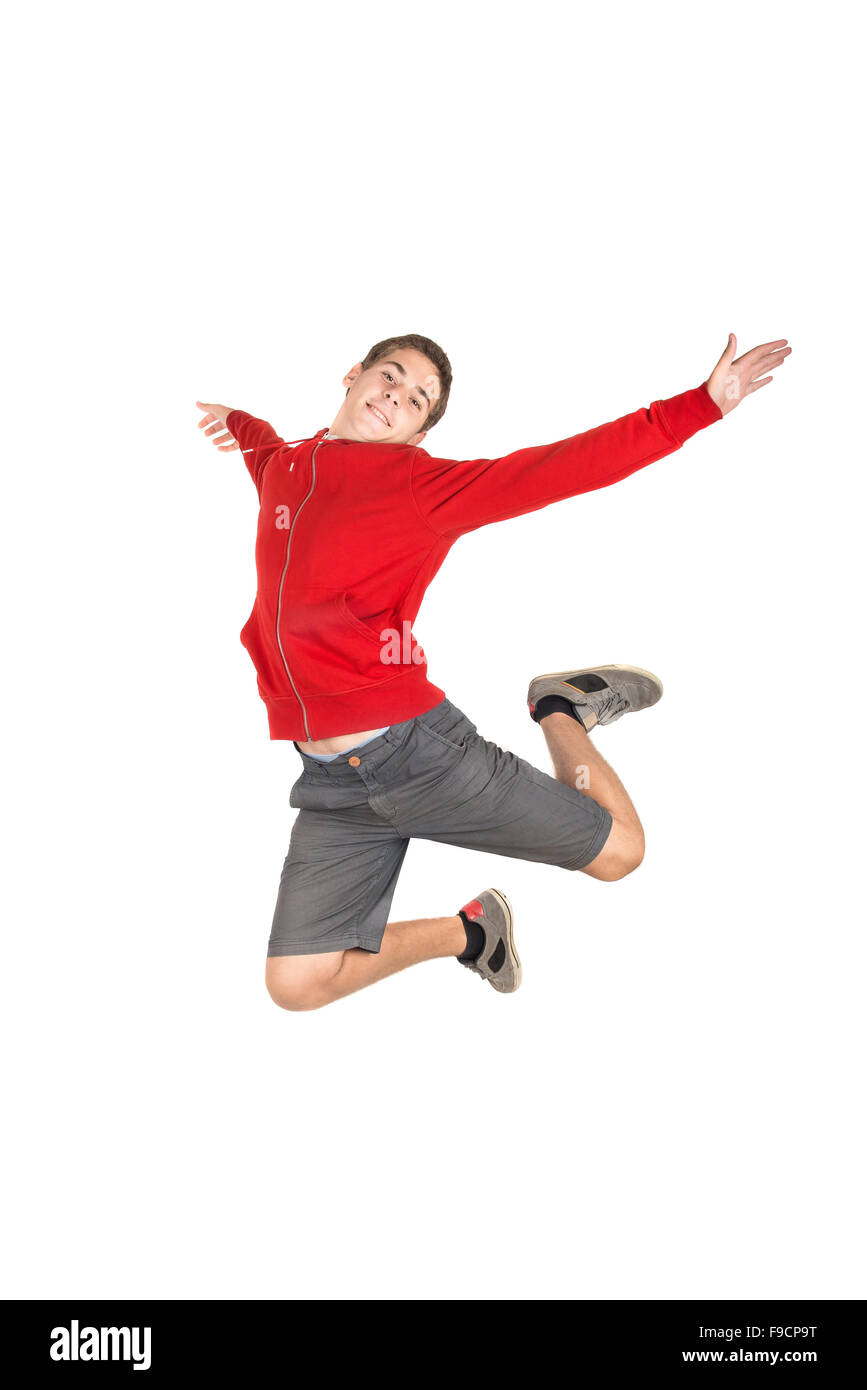 Teenage boy doing funny acrobatic jumps isolated in white Stock Photo ...