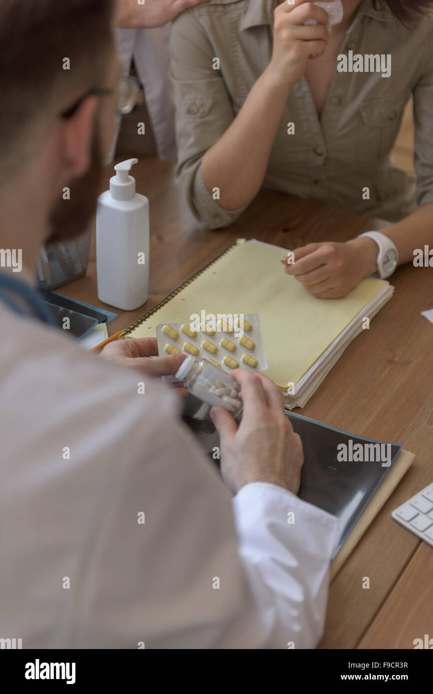 At doctor office. Doctor talking to crying patient after tests. Closeup ...