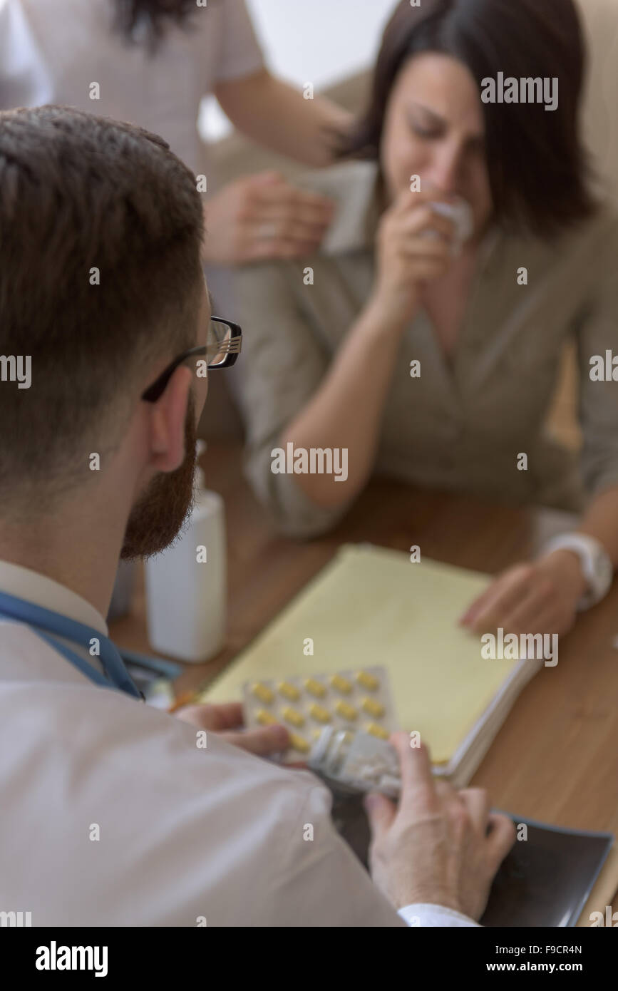 At doctor office. Doctor talking to crying patient after tests. Closeup ...