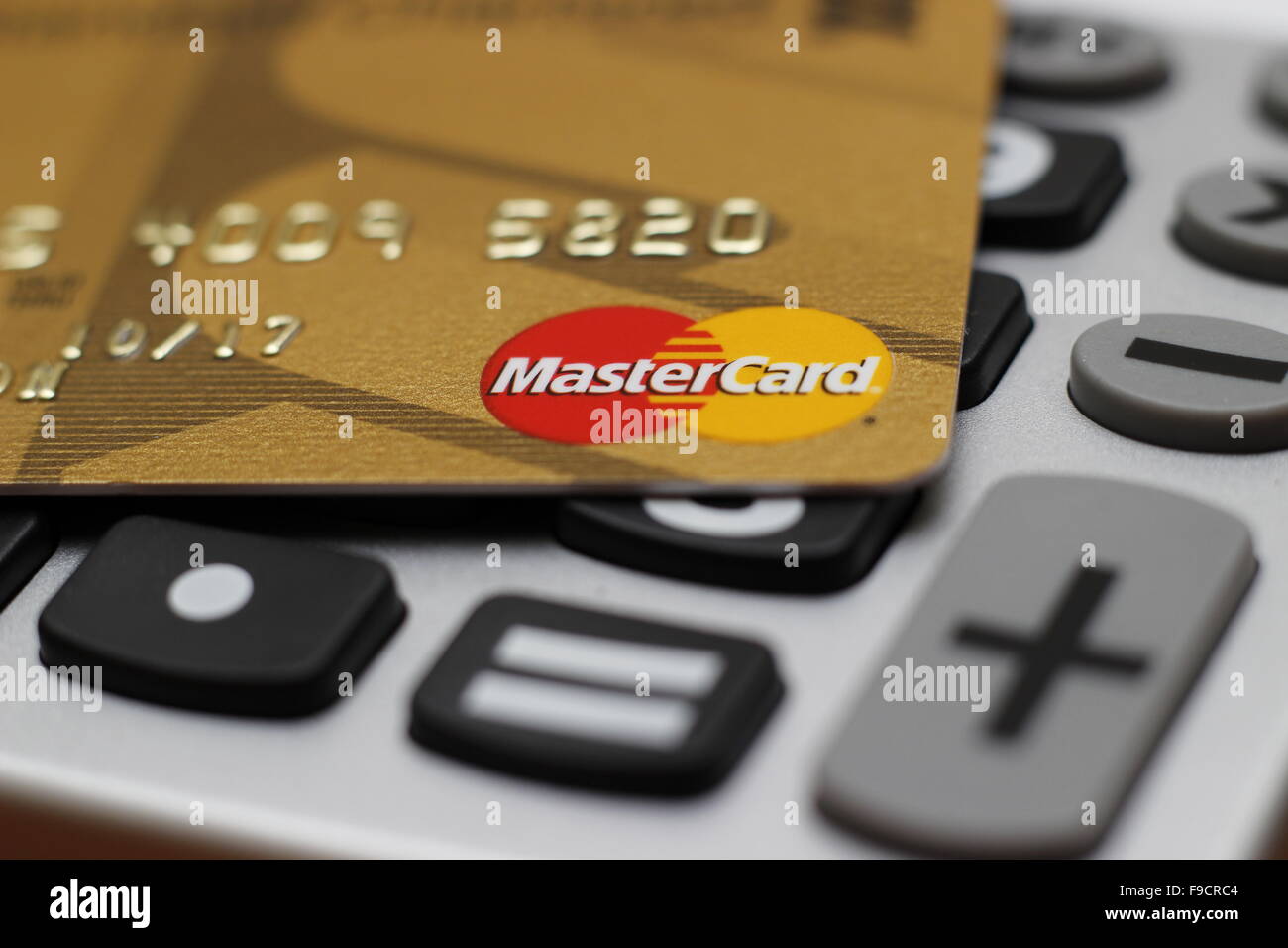 credit card on top of calculator Stock Photo - Alamy