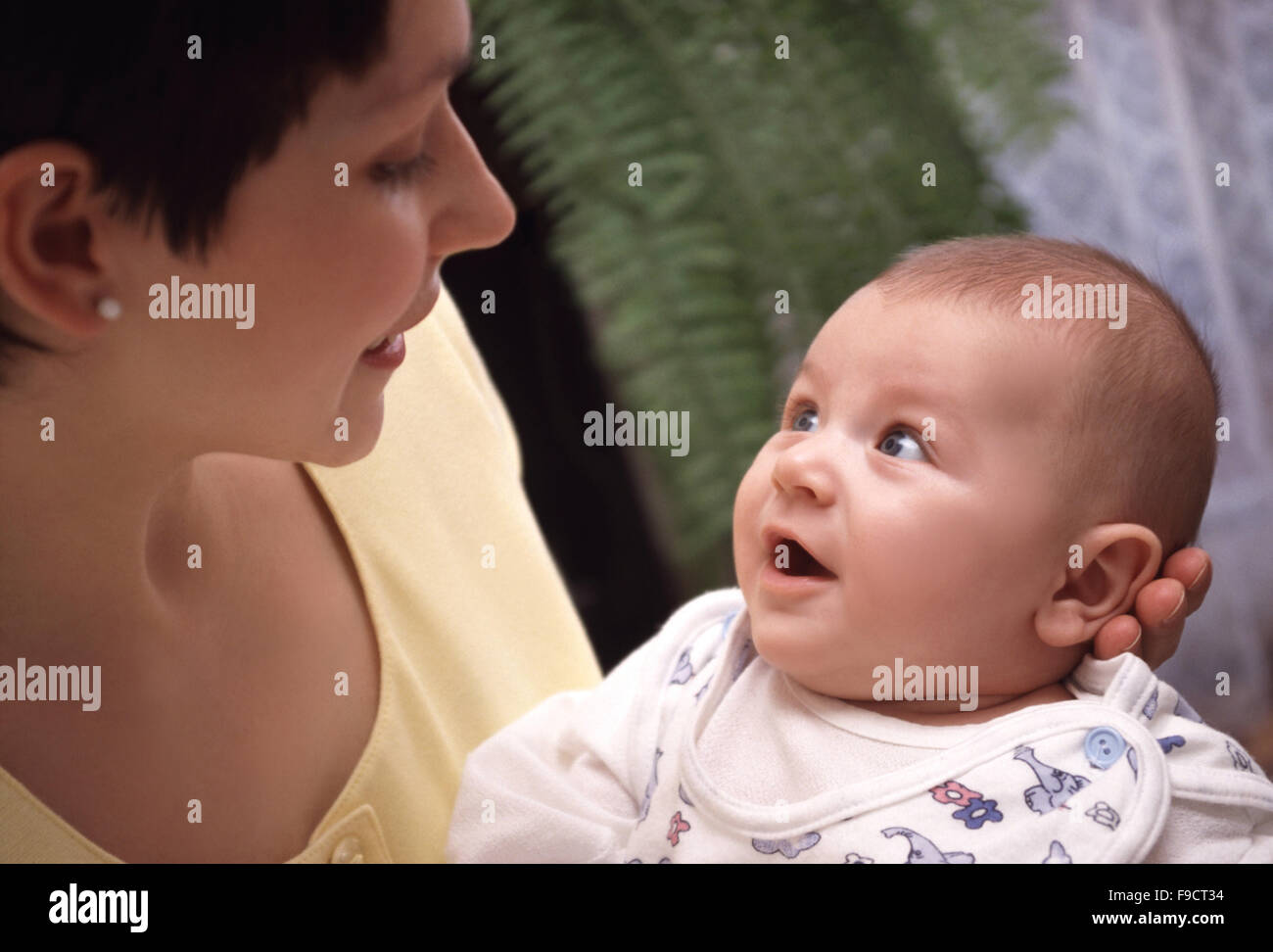 Young women talking babies hi-res stock photography and images - Alamy