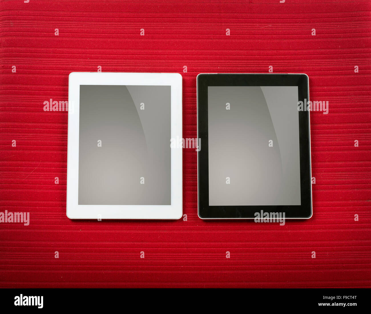 Tablet with isolated screen on red carpet Stock Photo - Alamy