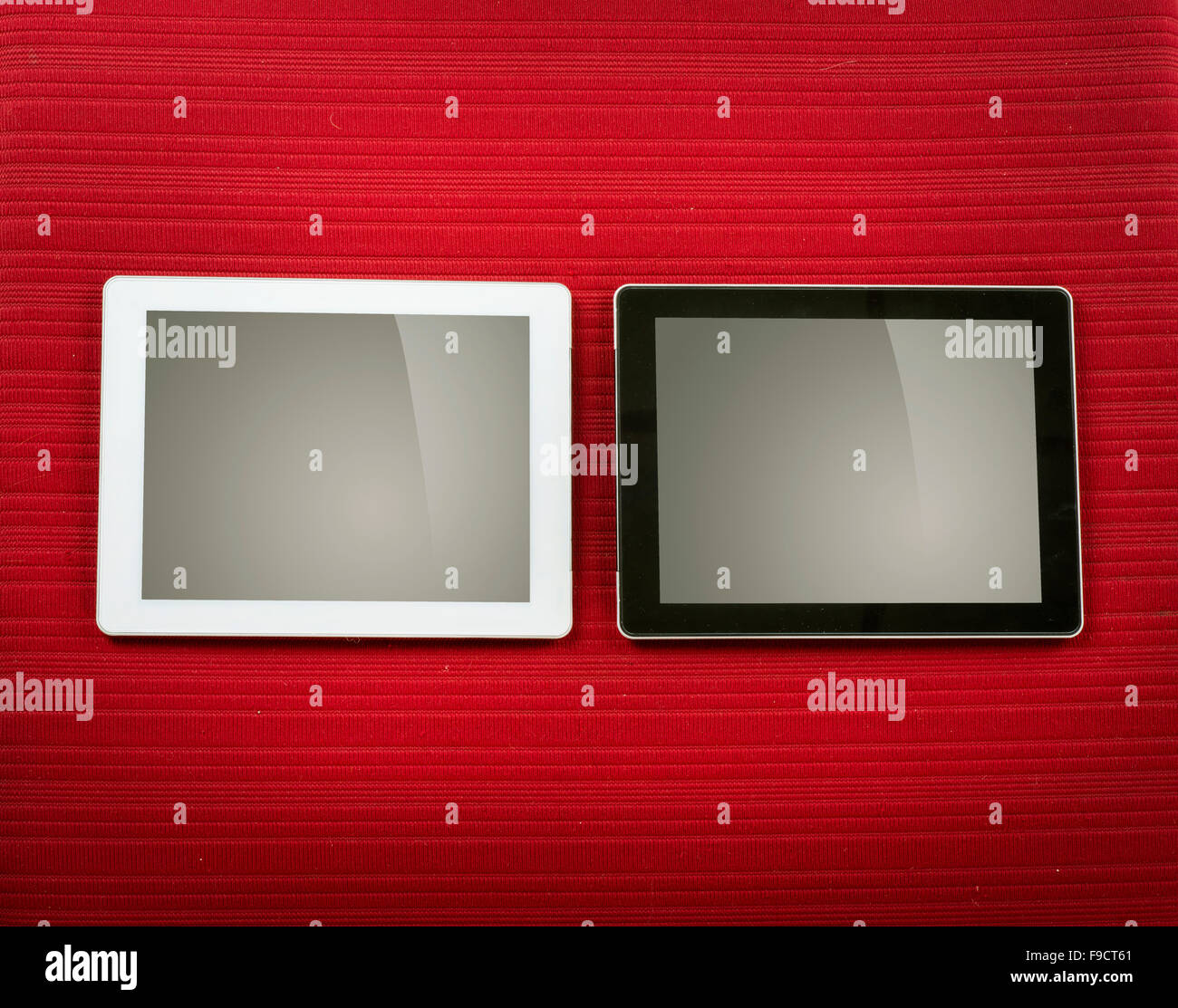 Tablet with isolated screen on red carpet Stock Photo - Alamy
