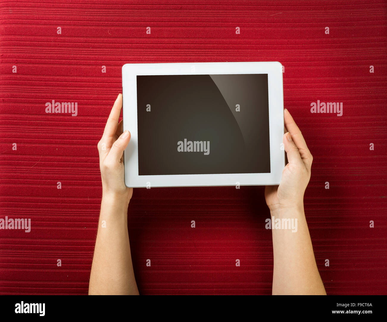 Female hands holding a tablet with isolated screen Stock Photo - Alamy