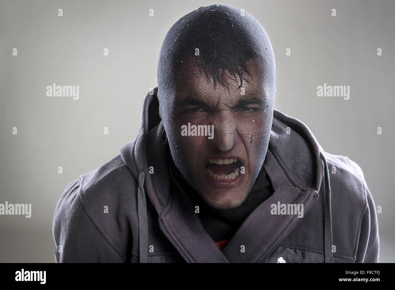 Dangerous man in mask is isolated on background Stock Photo - Alamy