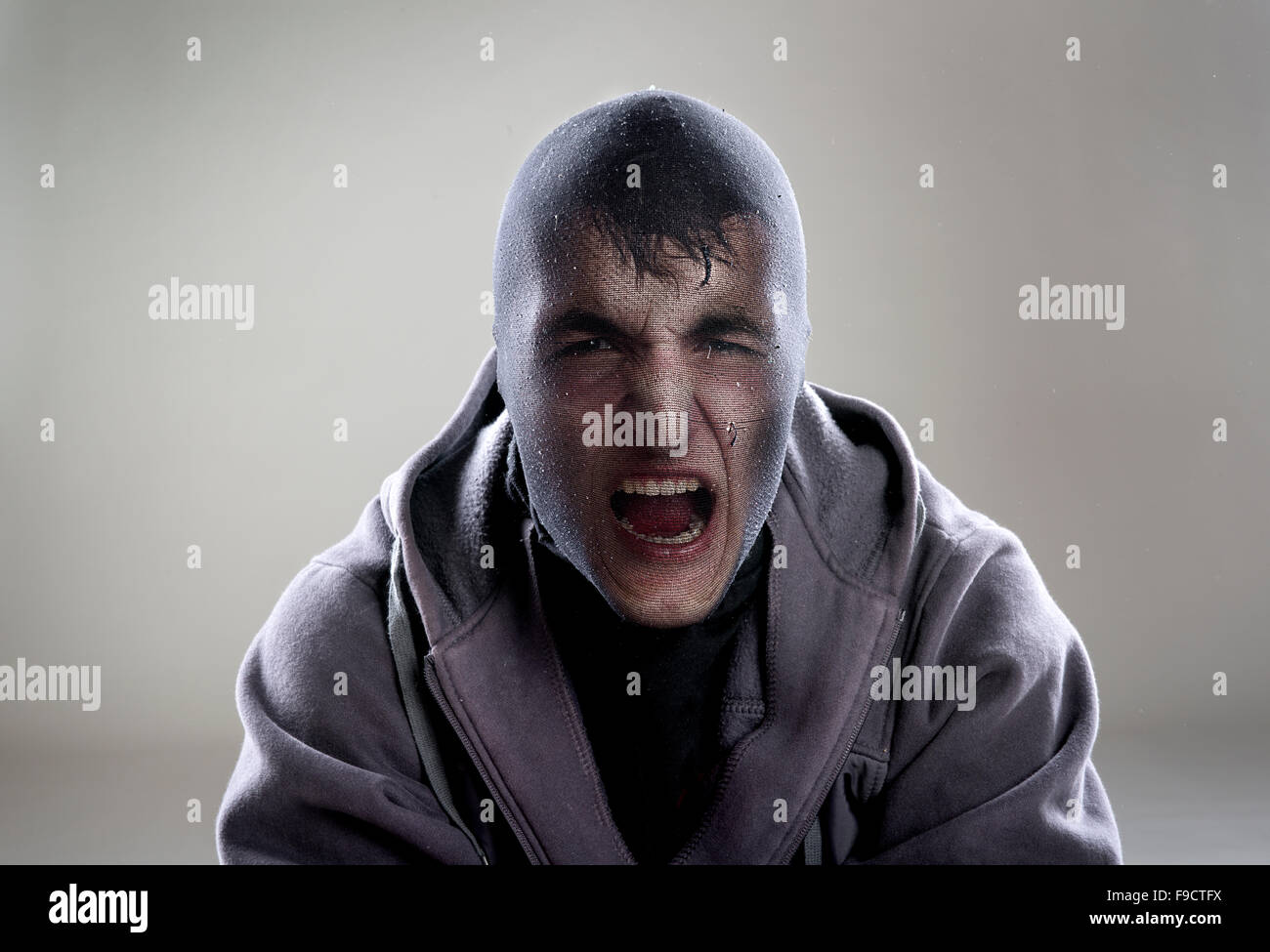 Dangerous man in mask is isolated on background Stock Photo - Alamy