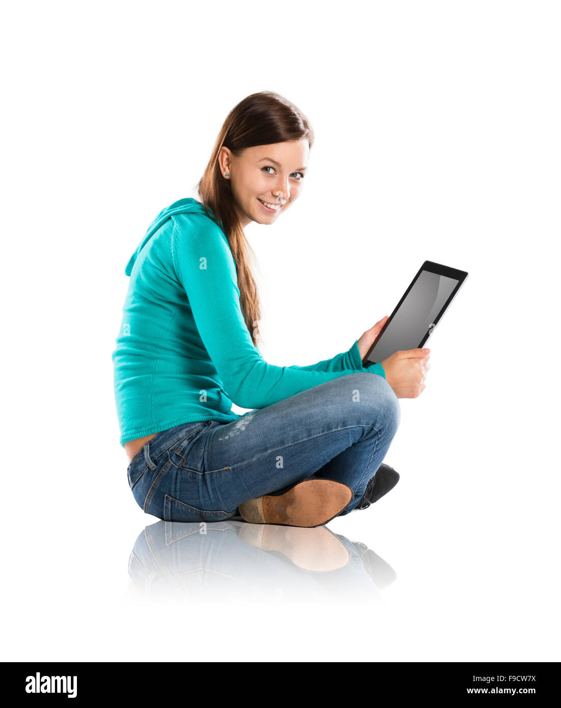 Beautiful young girl with tablet in studio Stock Photo - Alamy
