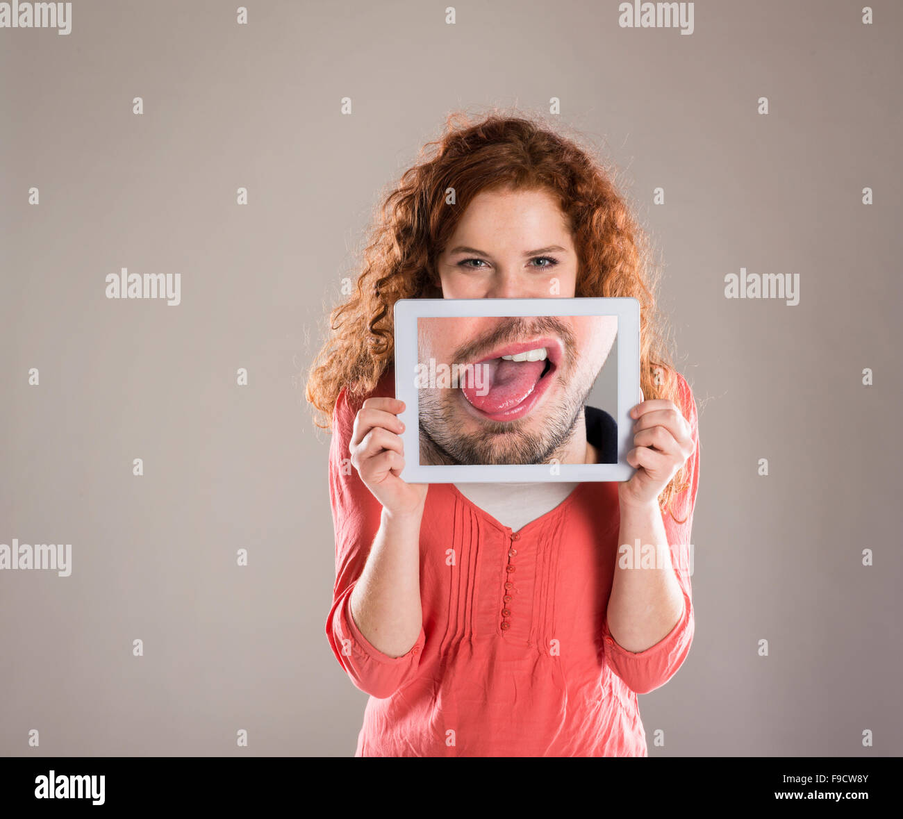 Funny studio portraits with tablet on isolated background Stock Photo ...