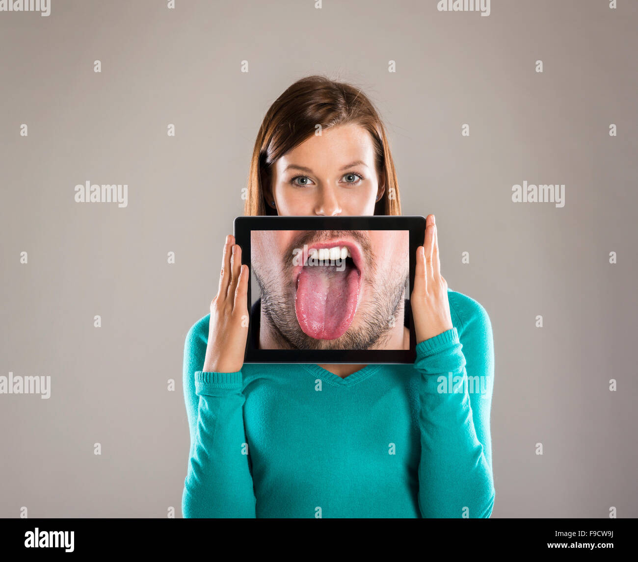 Funny studio portraits with tablet on isolated background Stock Photo ...