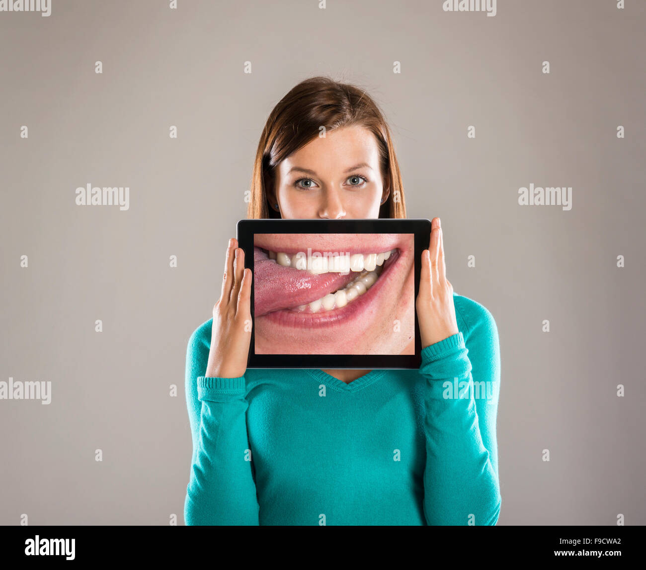 Funny studio portraits with tablet on isolated background Stock Photo ...