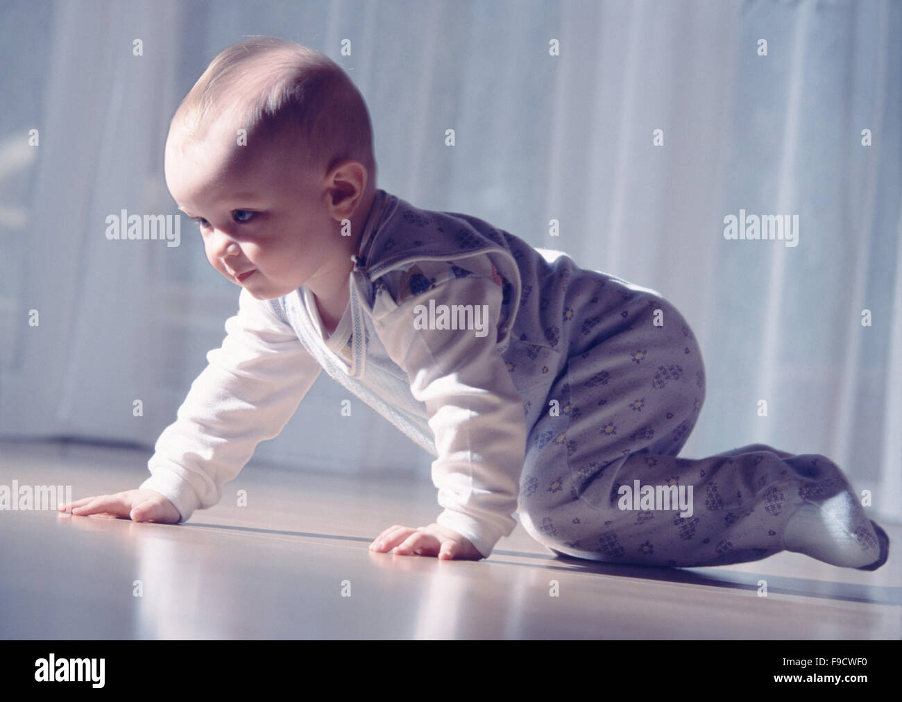 Baby scrambling (blue Stock Photo - Alamy