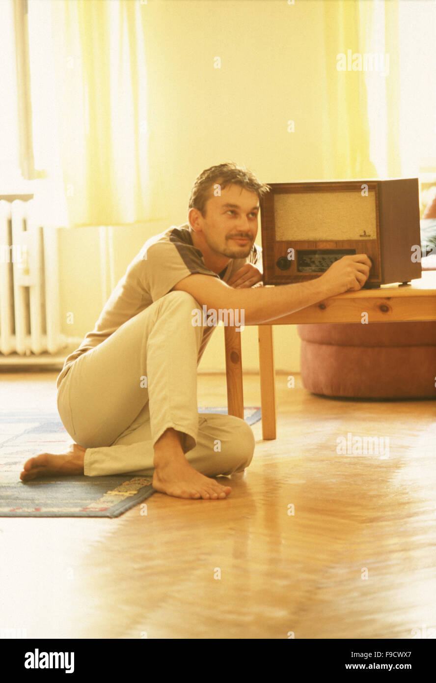 Old man tuning radio hi-res stock photography and images - Alamy