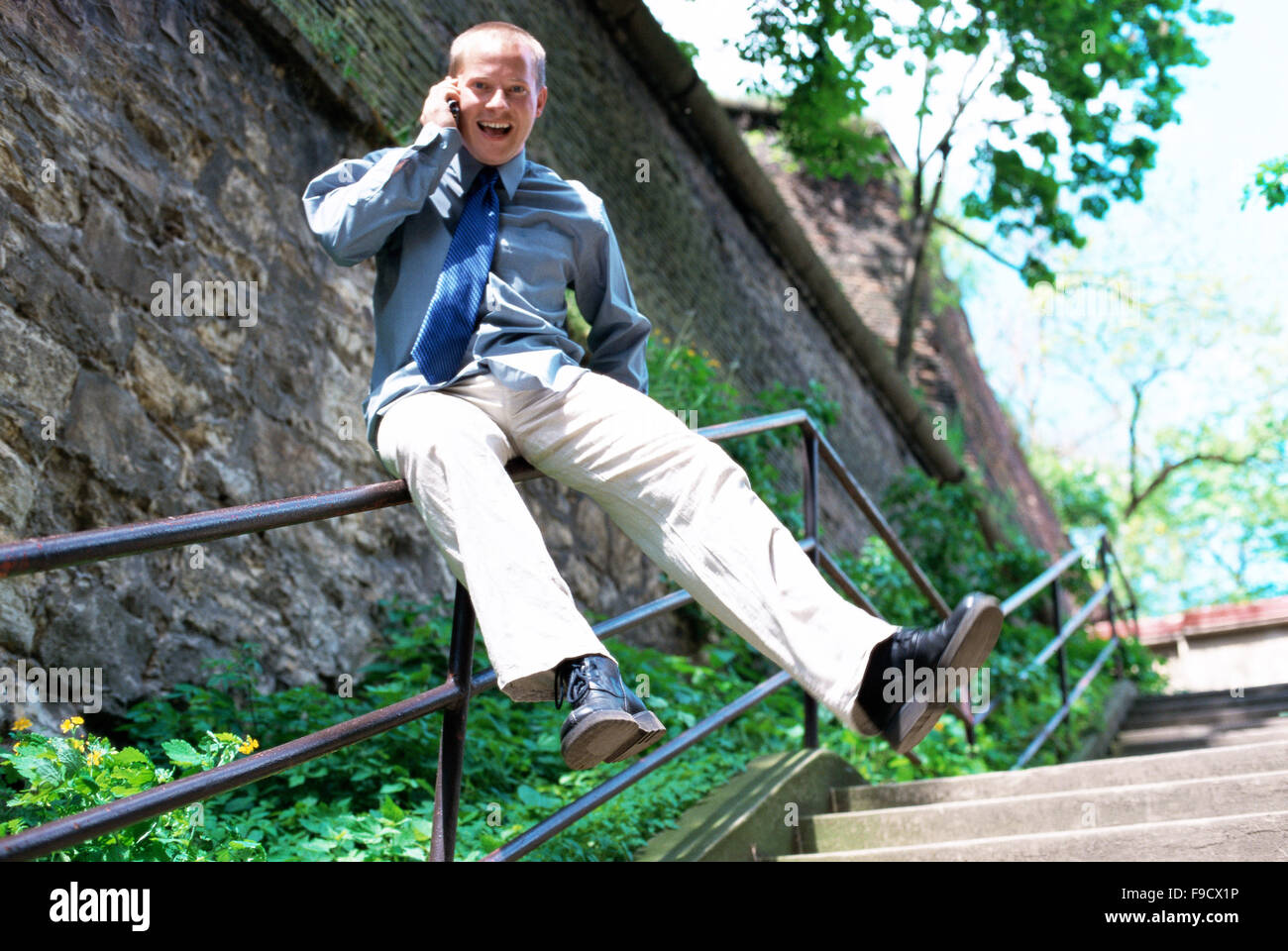 Man on slide stairs hi-res stock photography and images - Alamy