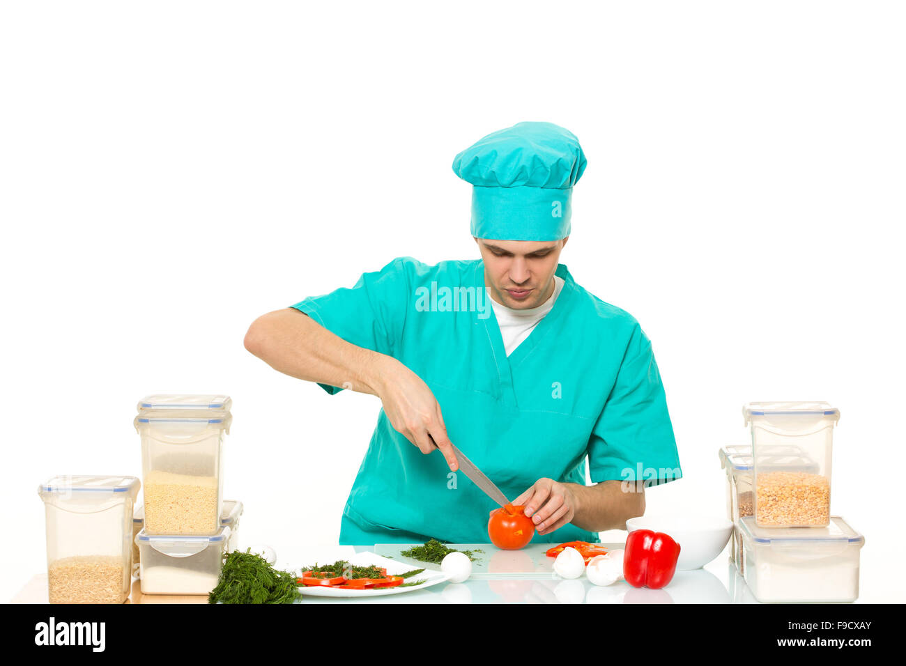 Friendly chef preparing vegetables in his kitchen. pepper loves Stock ...