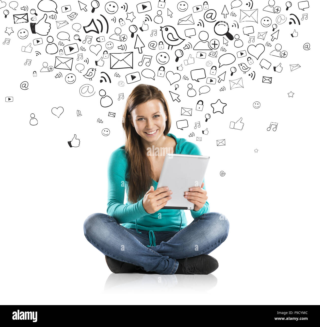 Beautiful young girl with tablet is using social media Stock Photo - Alamy