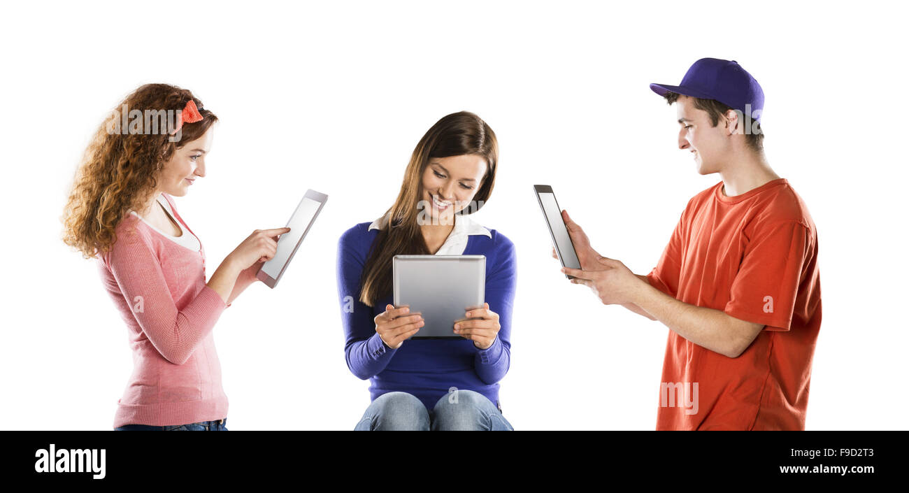 Beautiful young people with tablet in studio Stock Photo - Alamy