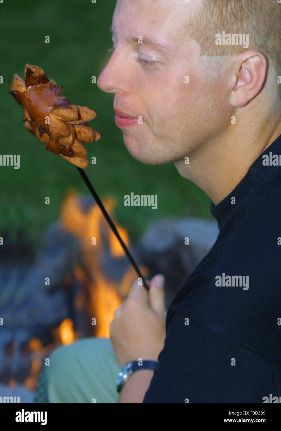 Guy Sniffing the Smell of His Supper Stock Photo - Alamy
