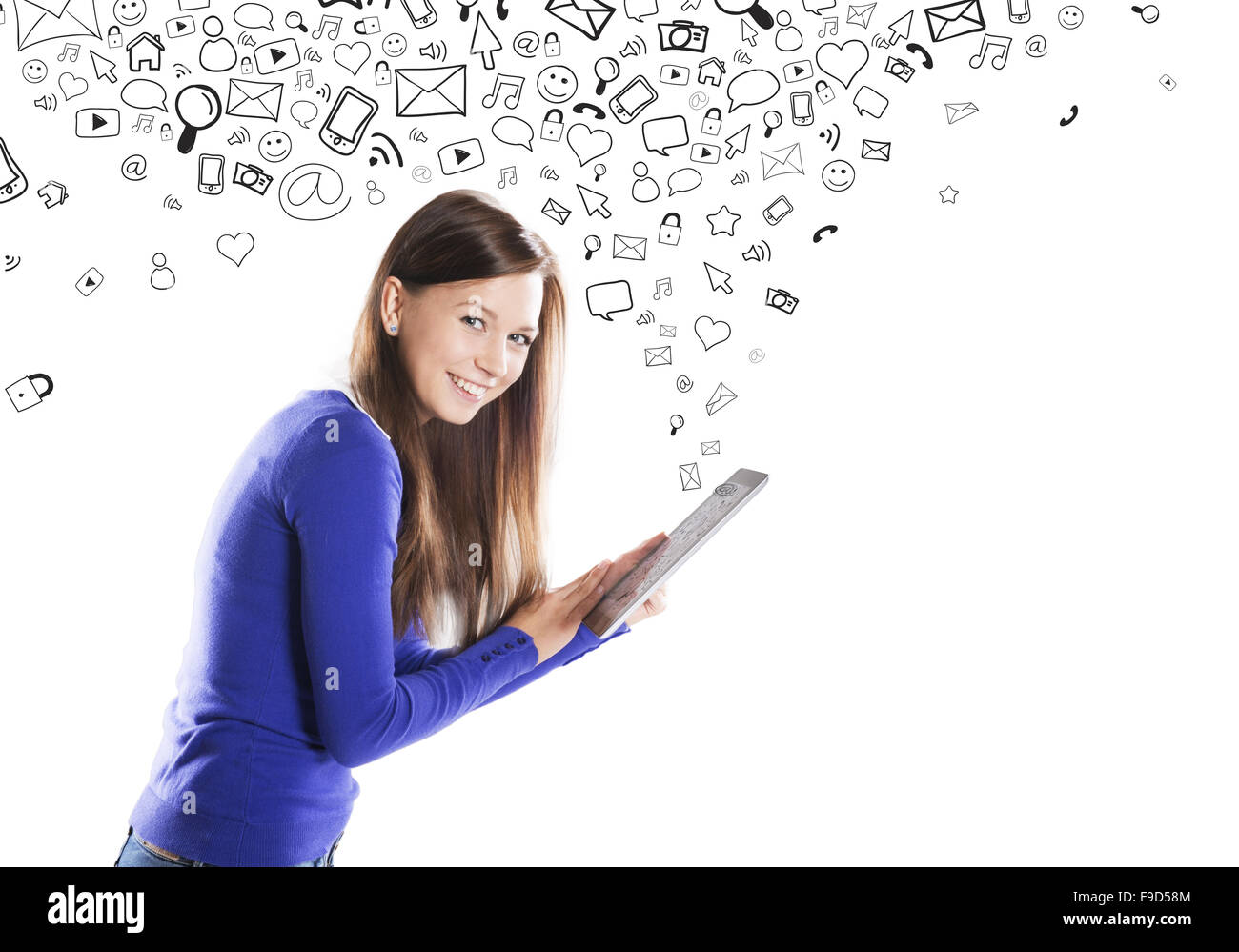 Beautiful young girl with tablet is using social media Stock Photo - Alamy