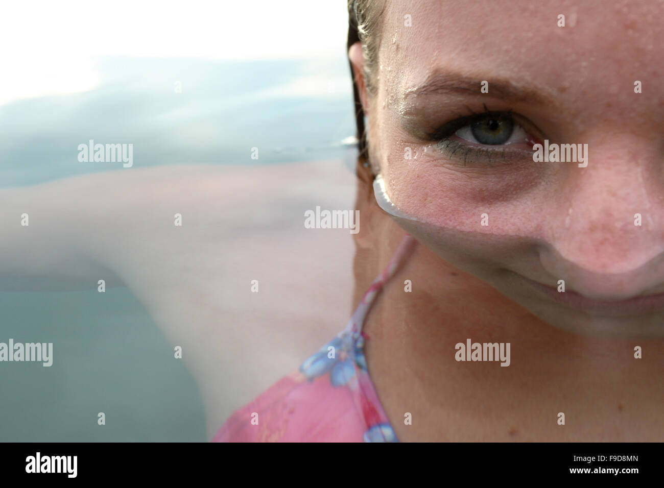 Woman Immersing Herself in Water Stock Photo - Alamy