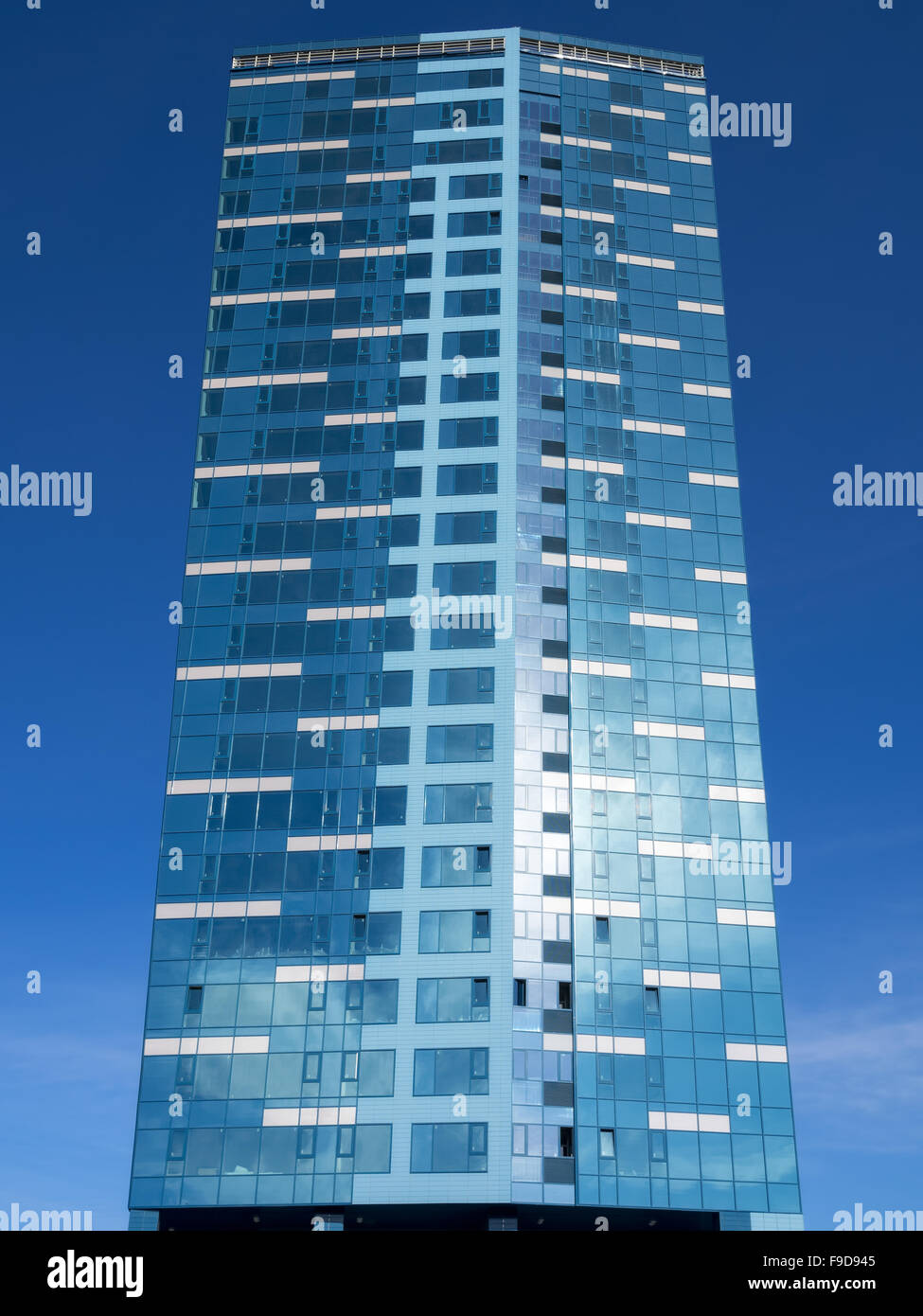 Wall of the modern building with windows and colorful glass facade ...