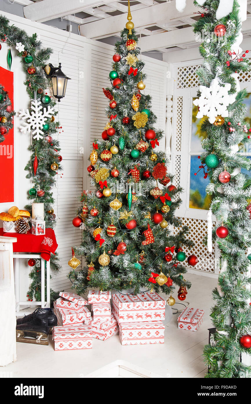 Green fir-tree with red and gold Christmas toys Stock Photo - Alamy