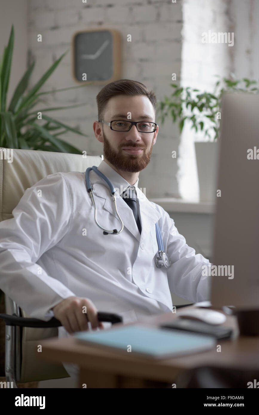 Doctor sitting relaxed in chair hi-res stock photography and images - Alamy
