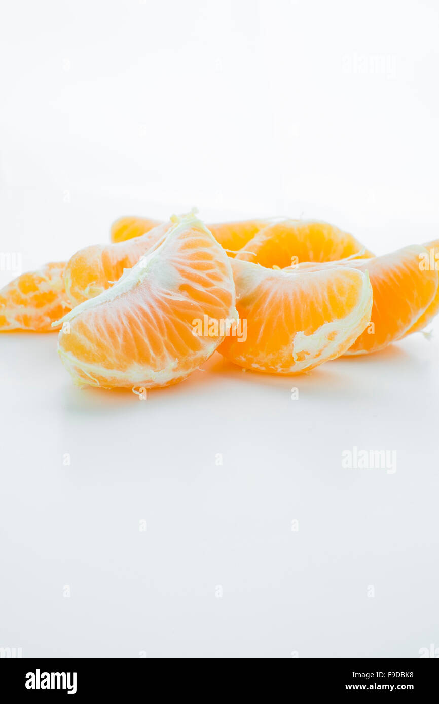 Slices of peeled Mandarin Stock Photo - Alamy
