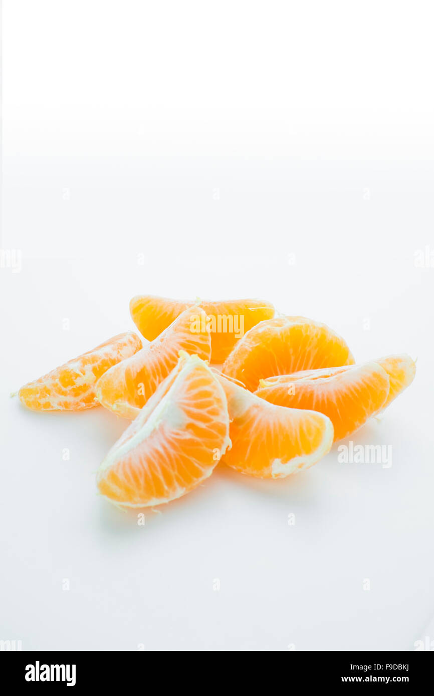 Slices of peeled Mandarin Stock Photo - Alamy