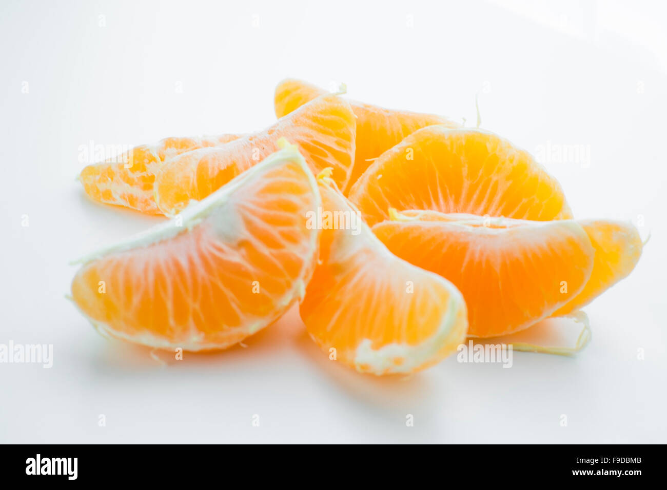 Slices of peeled Mandarin Stock Photo - Alamy