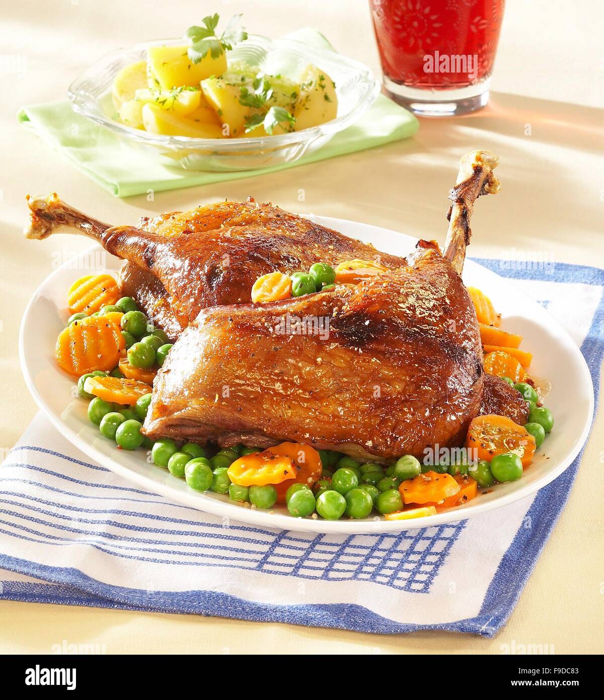 Goose Legs with Peas Stock Photo - Alamy