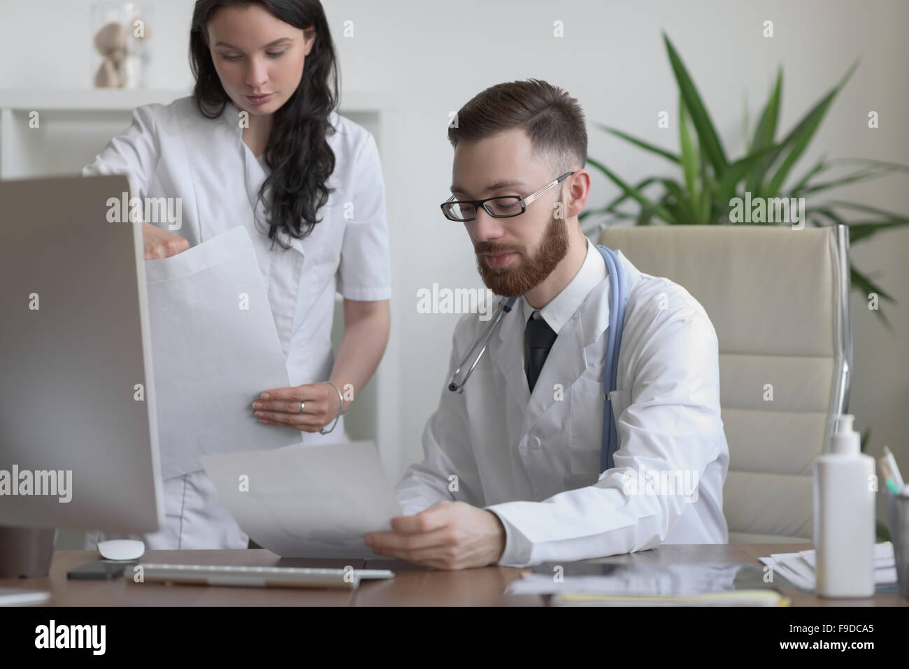 Two doctors discussing test results Stock Photo - Alamy