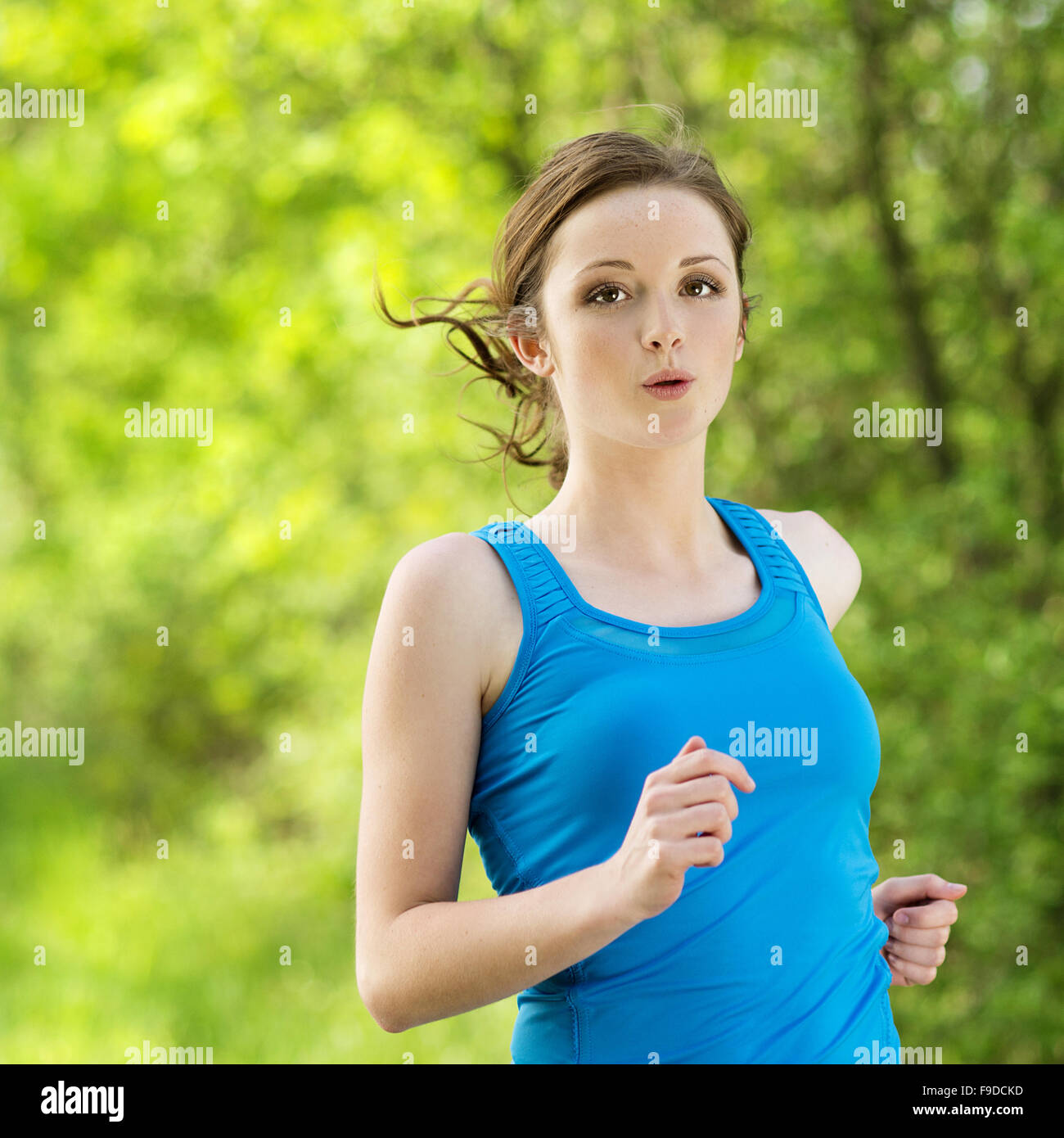 Pretty young girl runner in the forest Stock Photo - Alamy