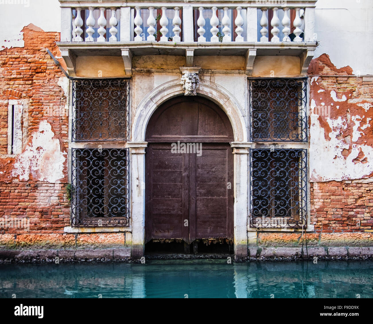 Venice, Italy House, exterior detail. Water damaged brickwork, arched ...