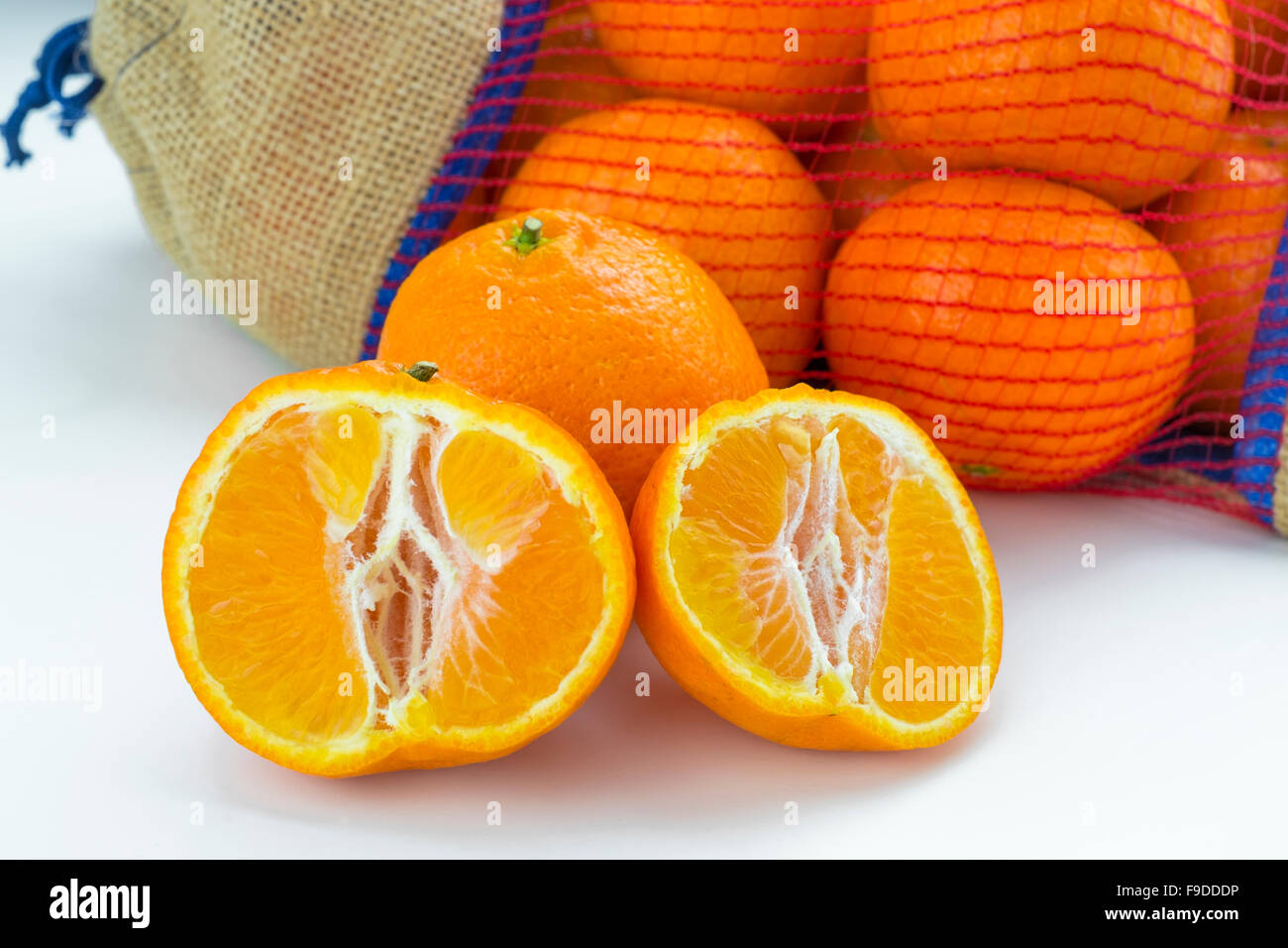 Sliced mandarin with a bag full Stock Photo - Alamy