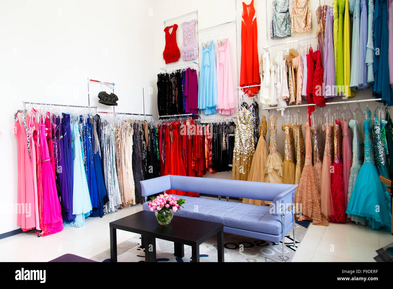 Dress shop with evening dresses on hangers Stock Photo - Alamy
